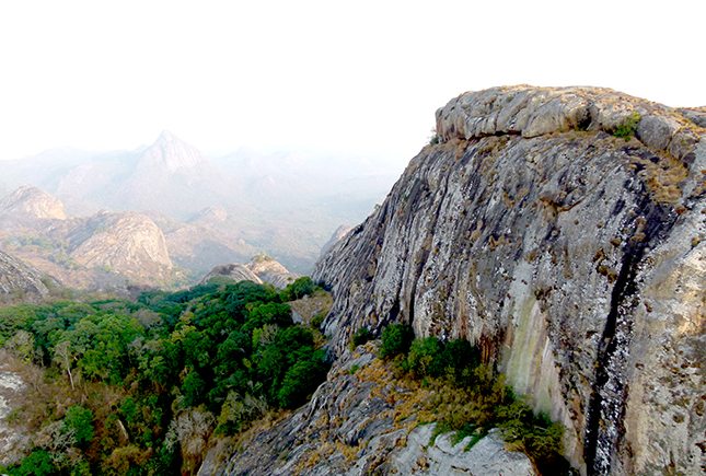 Flying over vast granite rock ourcrops in northern Uganda - Tropicair